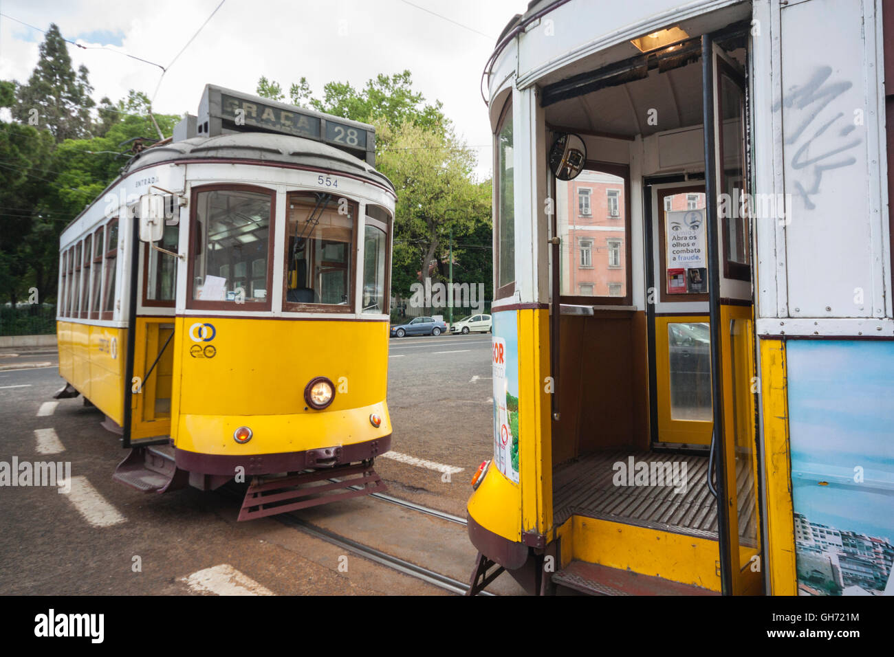 yellow Trams in Lisbon street scene Stock Photo - Alamy