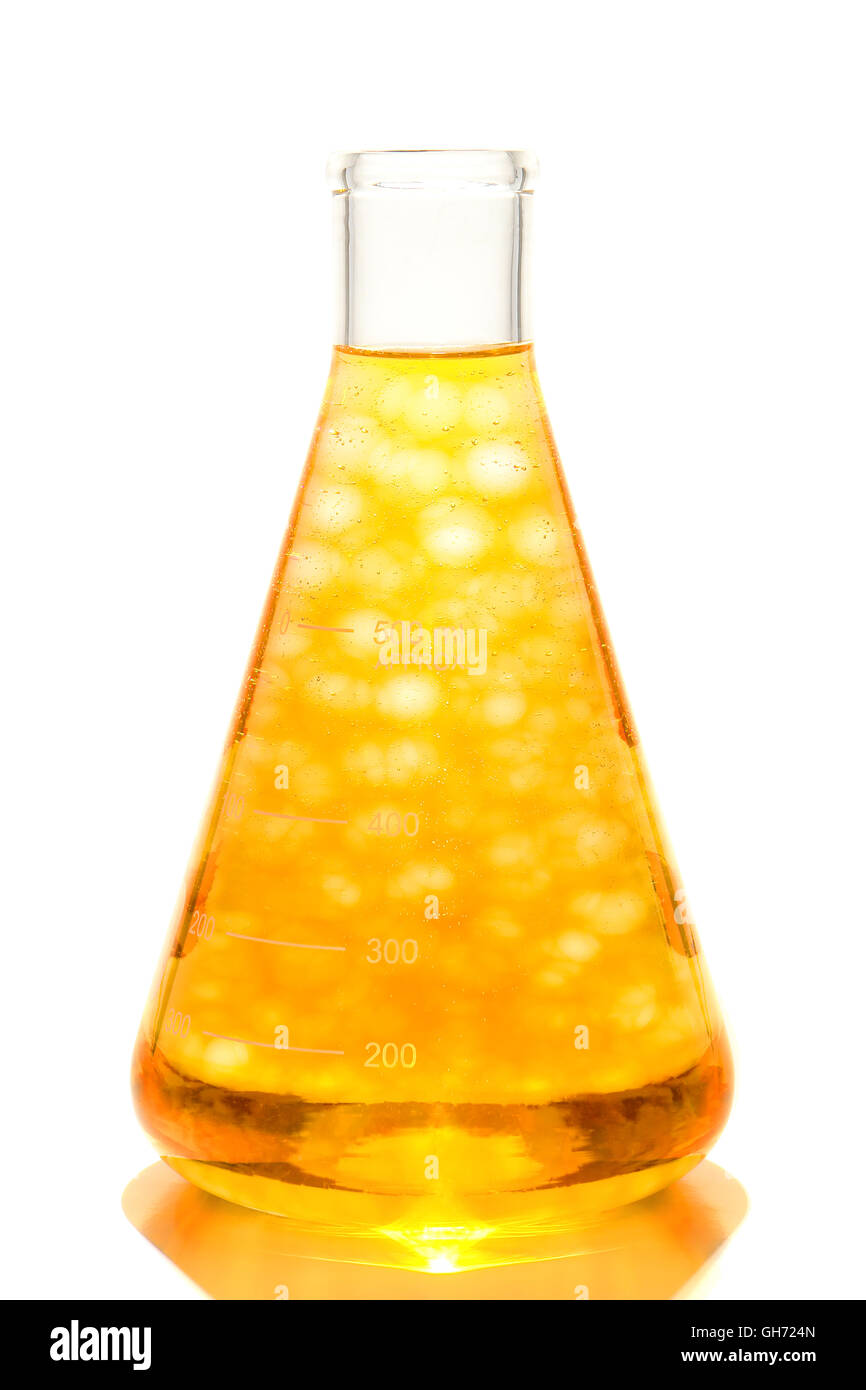 Scientific laboratory glass conical Erlenmeyer flask with yellow ...