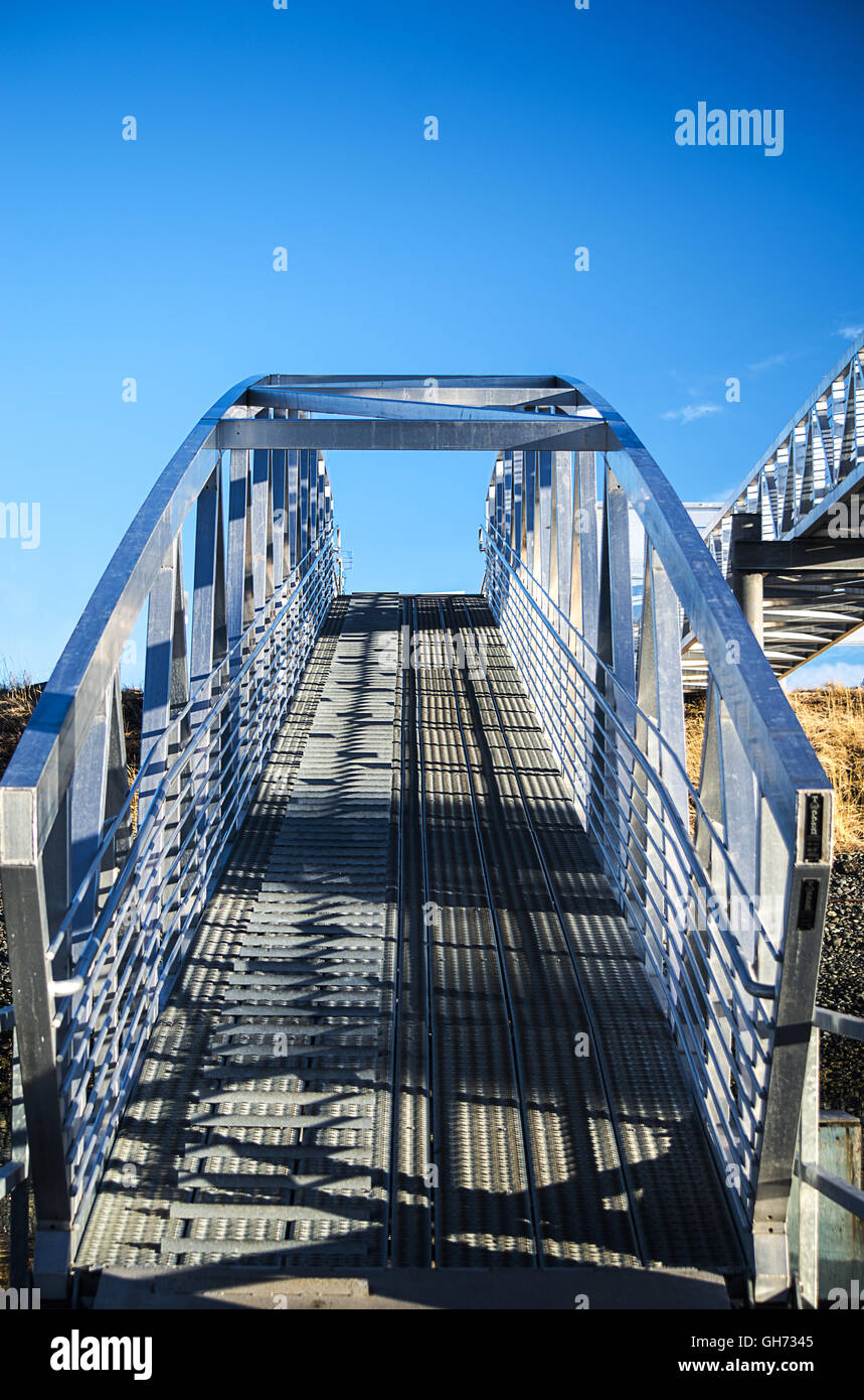 A ramp leads up to a clear blue sky Stock Photo - Alamy