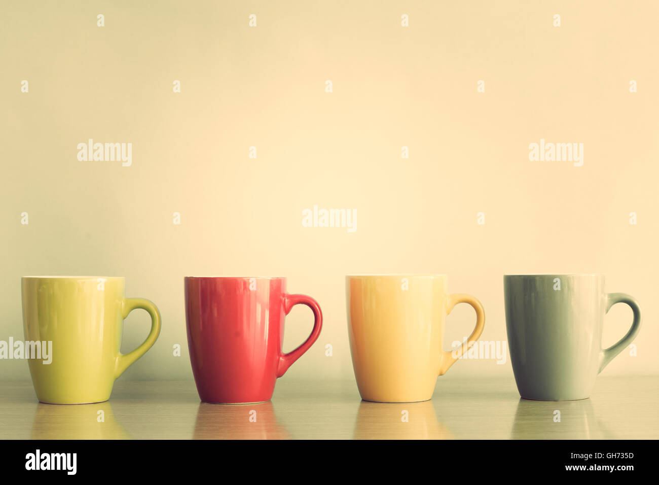 Colorful coffee cups in a row Stock Photo - Alamy