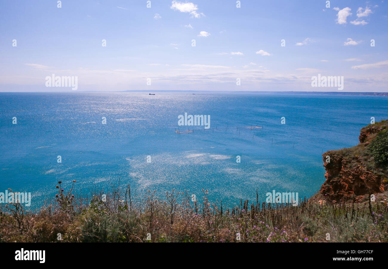Endless sea distance and boat on the horizon Stock Photo - Alamy
