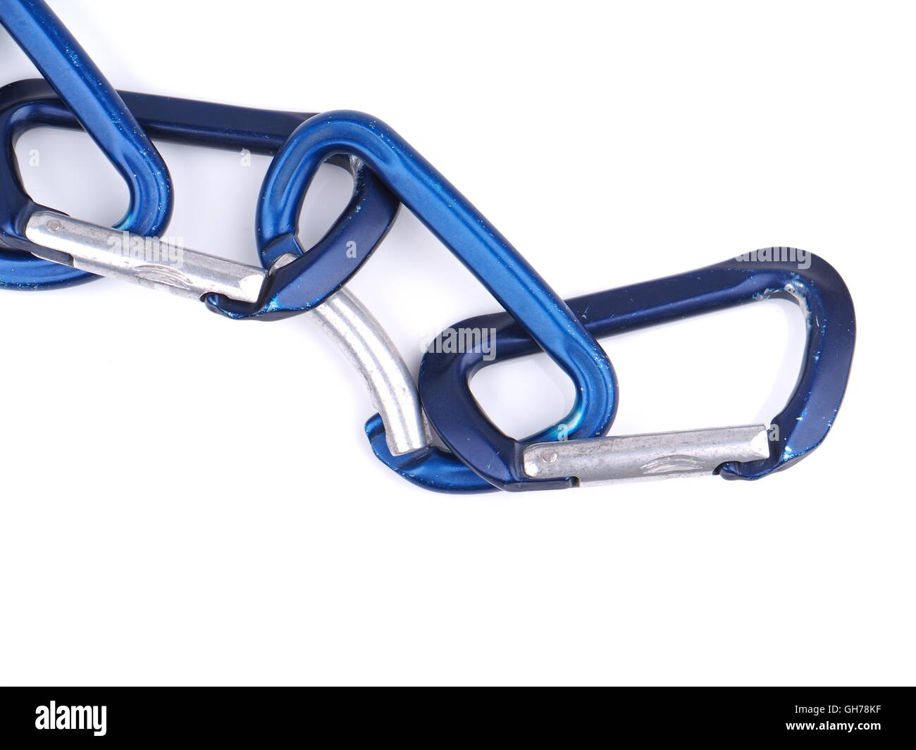 blue climbing carabiners on a white background Stock Photo - Alamy