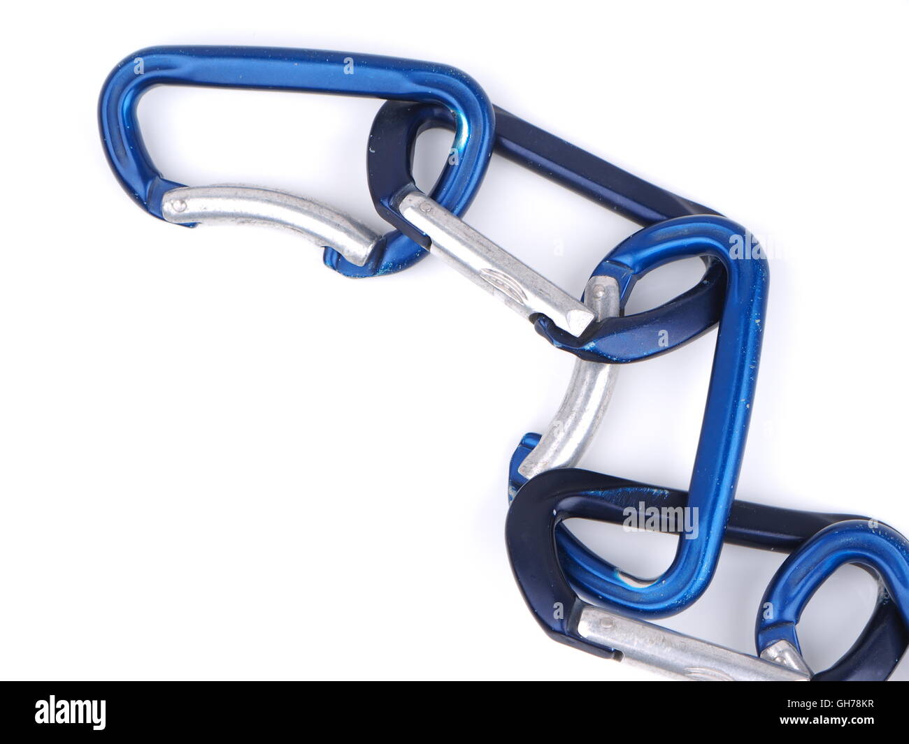 blue climbing carabiners on a white background Stock Photo - Alamy