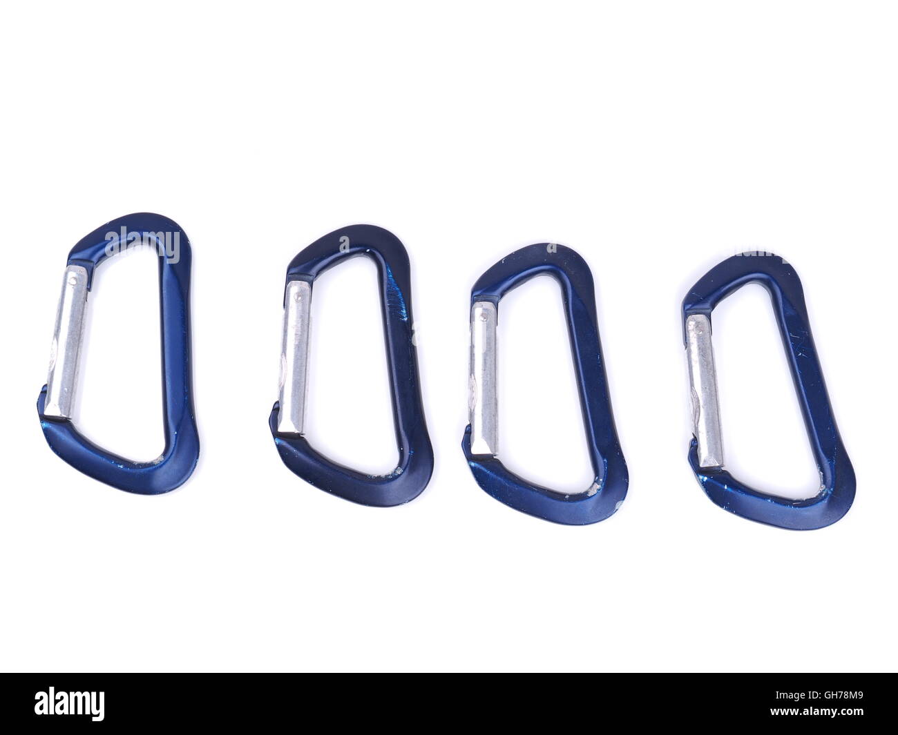 blue climbing carabiners on a white background Stock Photo - Alamy