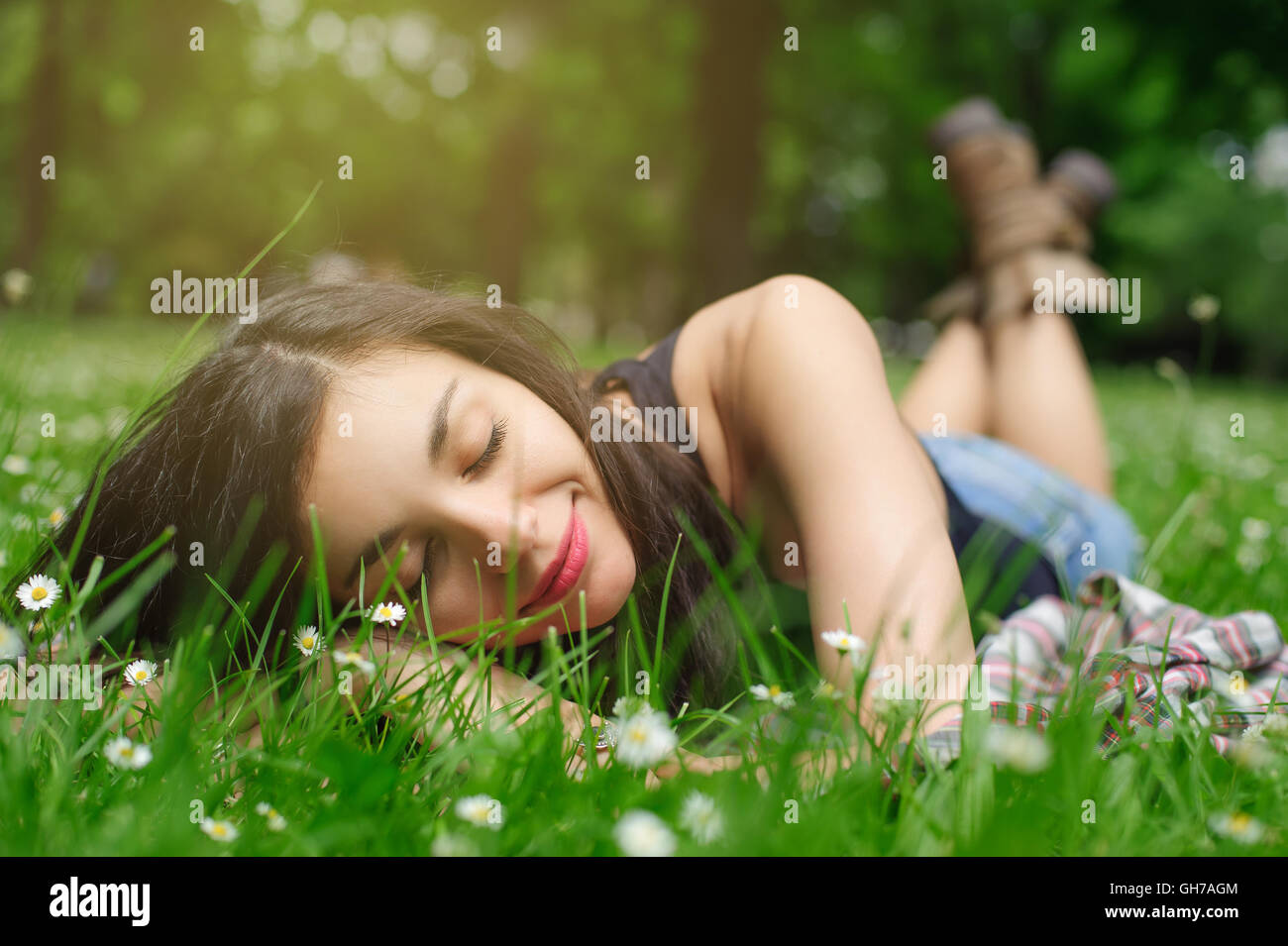 Girl resting in meadow Stock Photo - Alamy