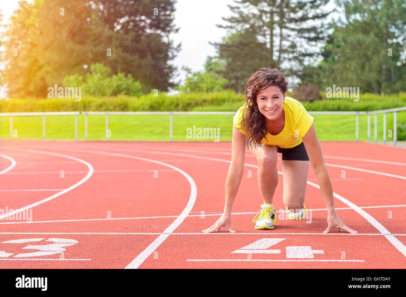 Woman in running position hi-res stock photography and images - Alamy
