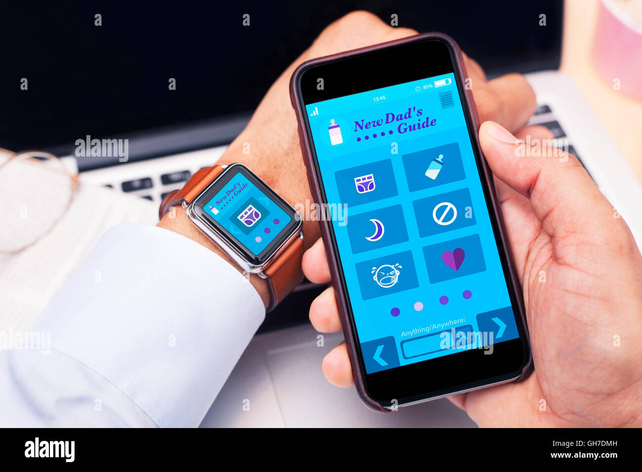 Businessman using app with his smartwatch Stock Photo - Alamy