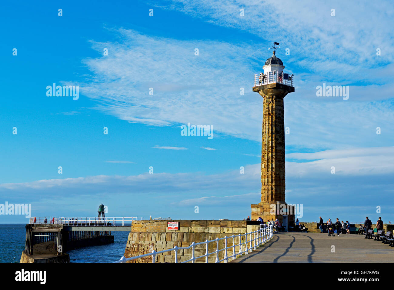 Pier and lighthouse, Whitby, North Yorkshire, England UK Stock Photo ...