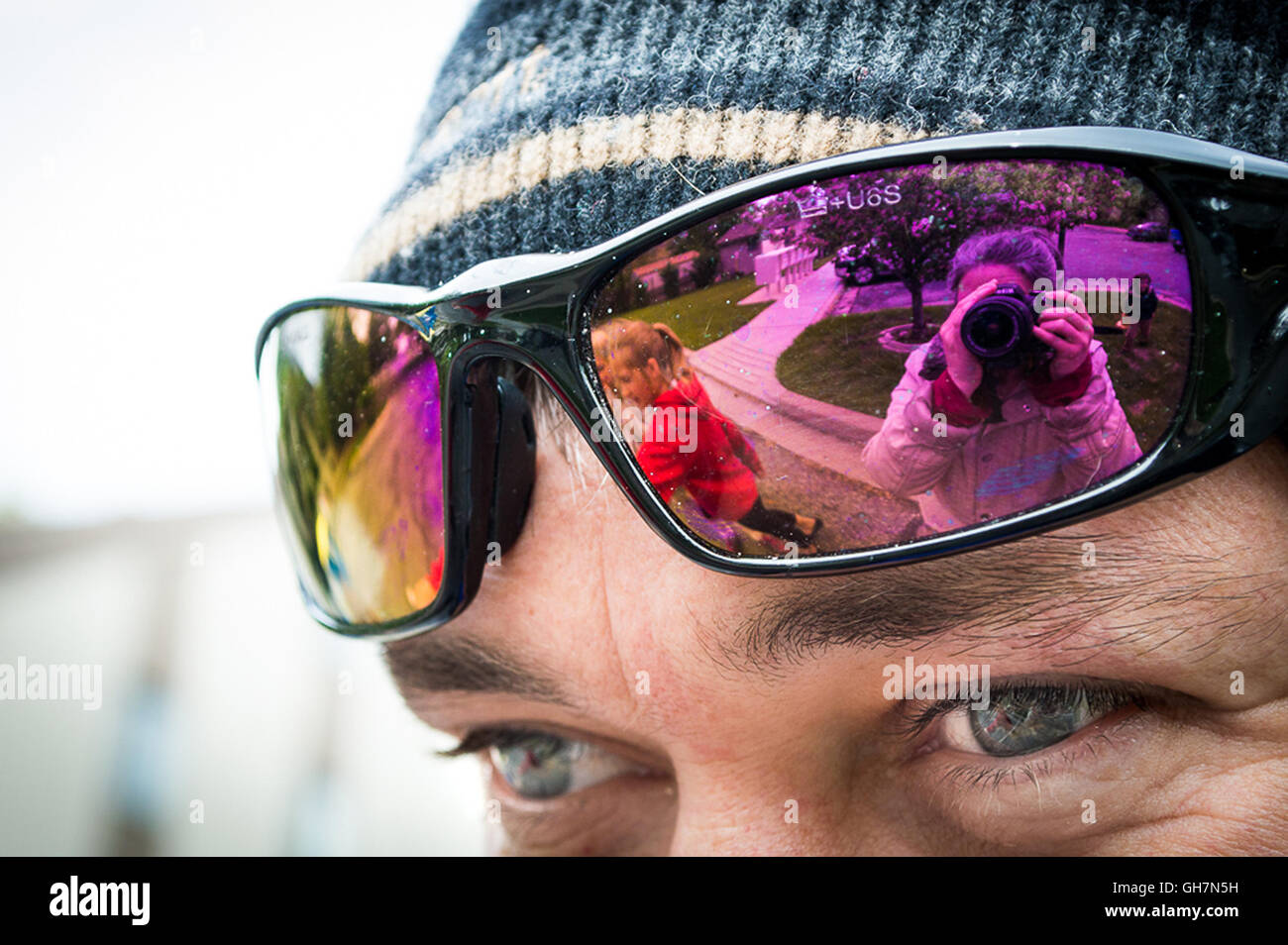 reflection in sun glasses above mans eyes mans Stock Photo - Alamy
