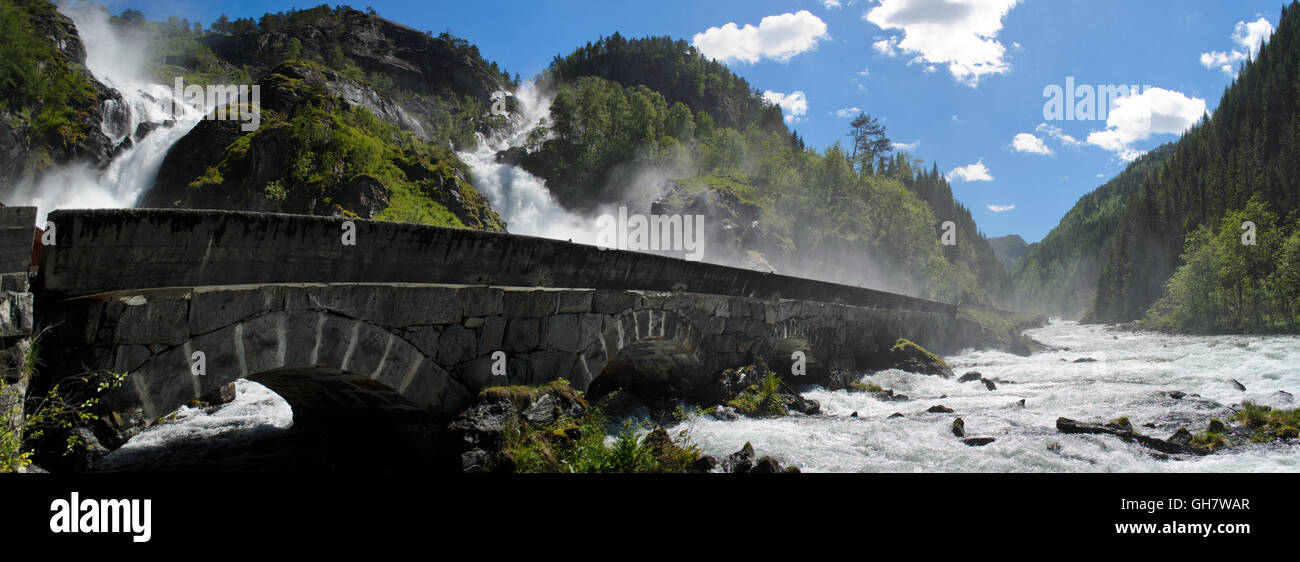 The old stone bridge and Latefossen waterfall, falling into the white ...