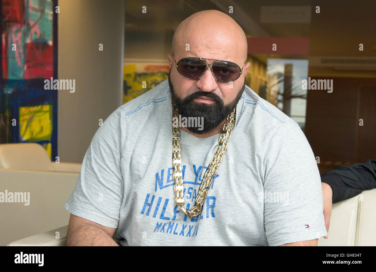 Berlin, Germany. 14th July, 2017. Rapper Xatar sits on a couch before ...