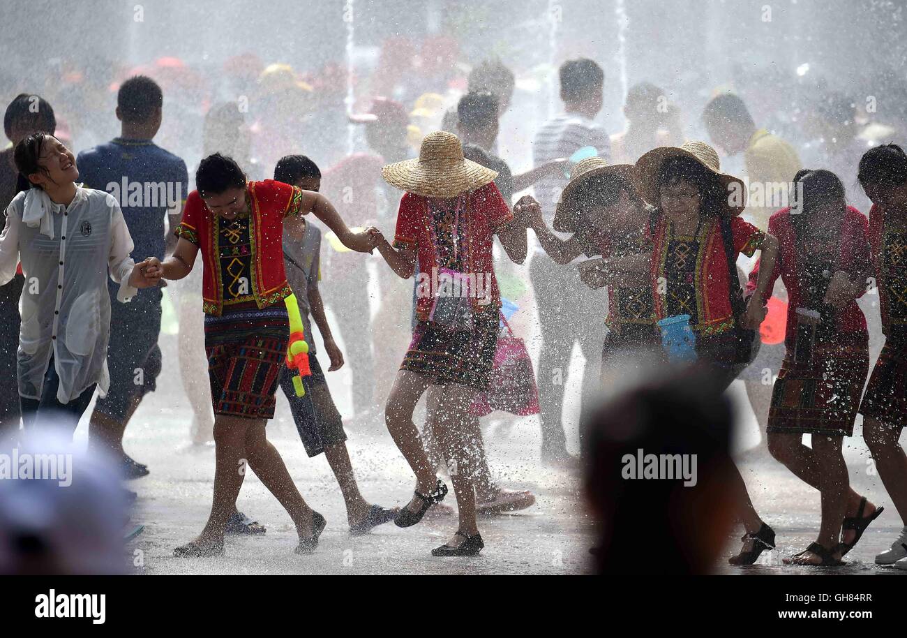 Baoting, China's Hainan Province. 9th Aug, 2016. People splash water at ...