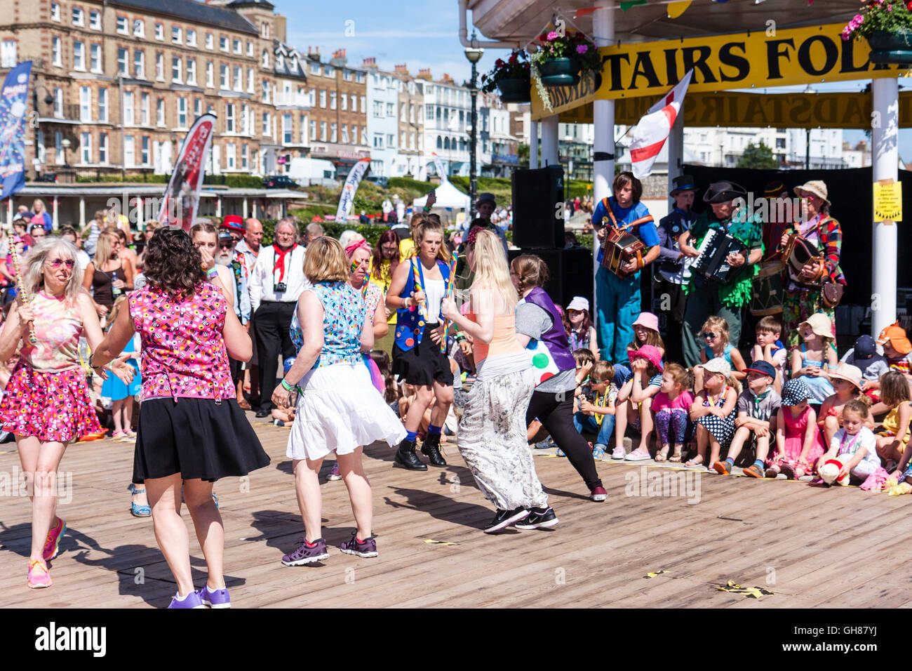 Broadstairs Folk week festival. Three musicians in bandstand, playing ...
