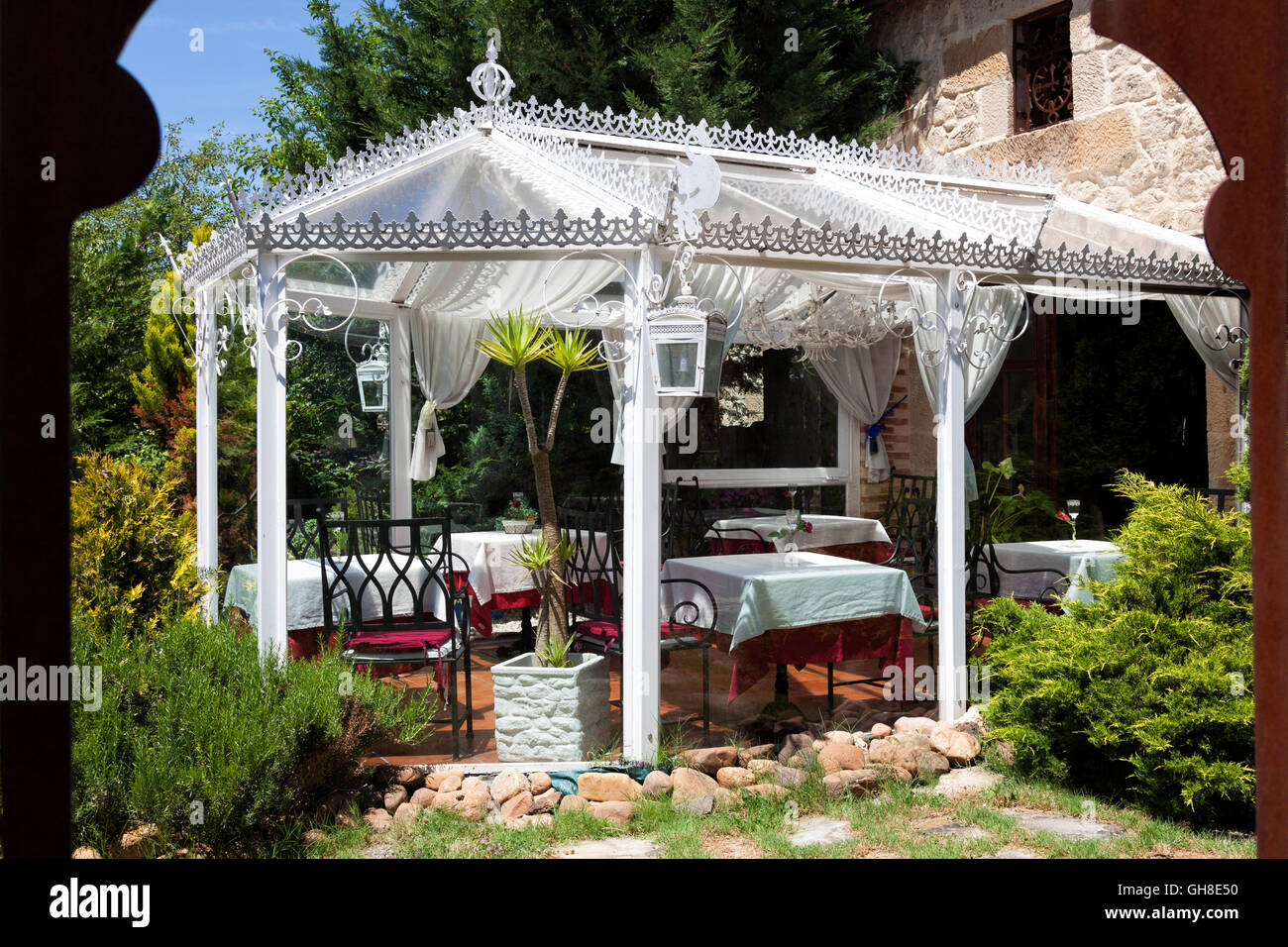 Old style white arbour in a garden Stock Photo - Alamy