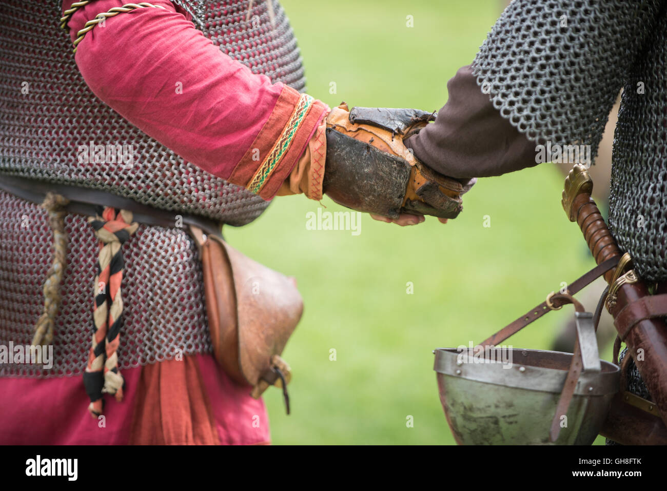 Viking battle re-enactment. handshake after battle Stock Photo - Alamy