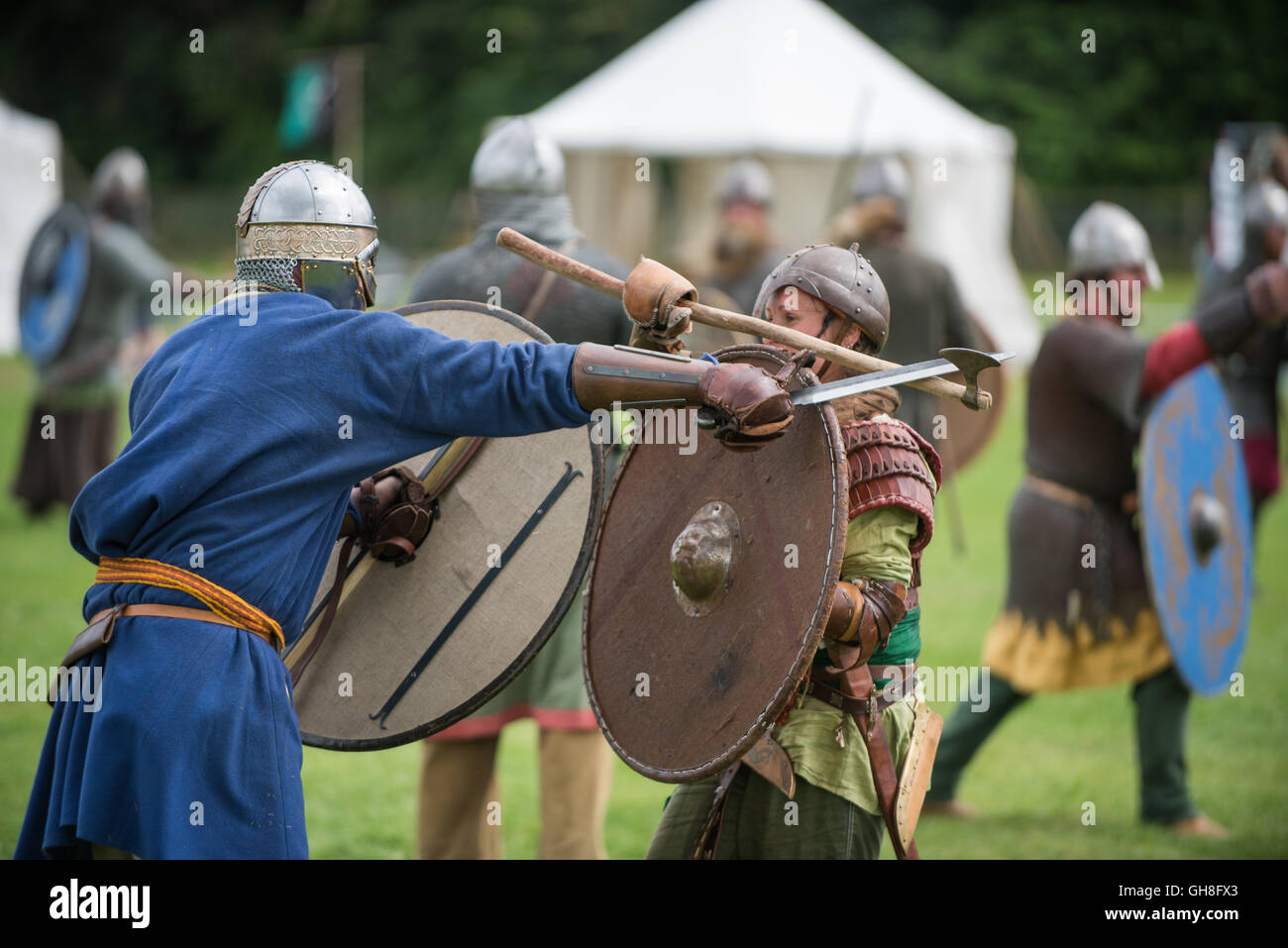 Viking battle reenactment. sword against axe Stock Photo - Alamy