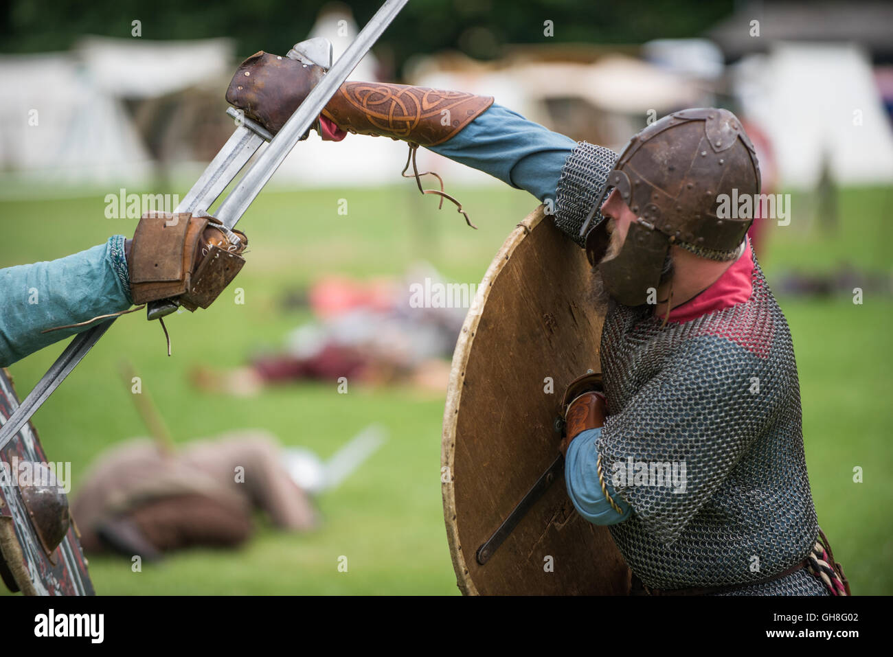 Viking battle re-enactment. One on one combat. Sword to wrist Stock ...