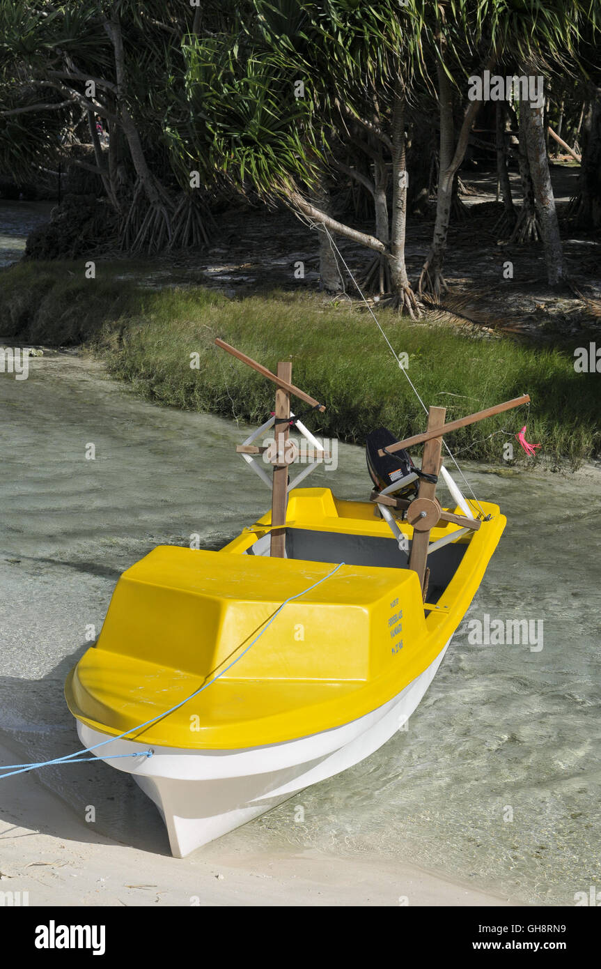 Yellow fishing boat at beach Stock Photo - Alamy