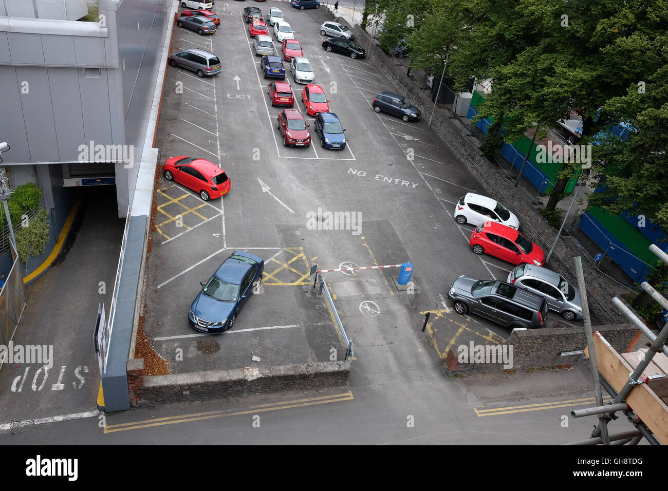 Private city car parking lot with direction arrow and barriers, August ...