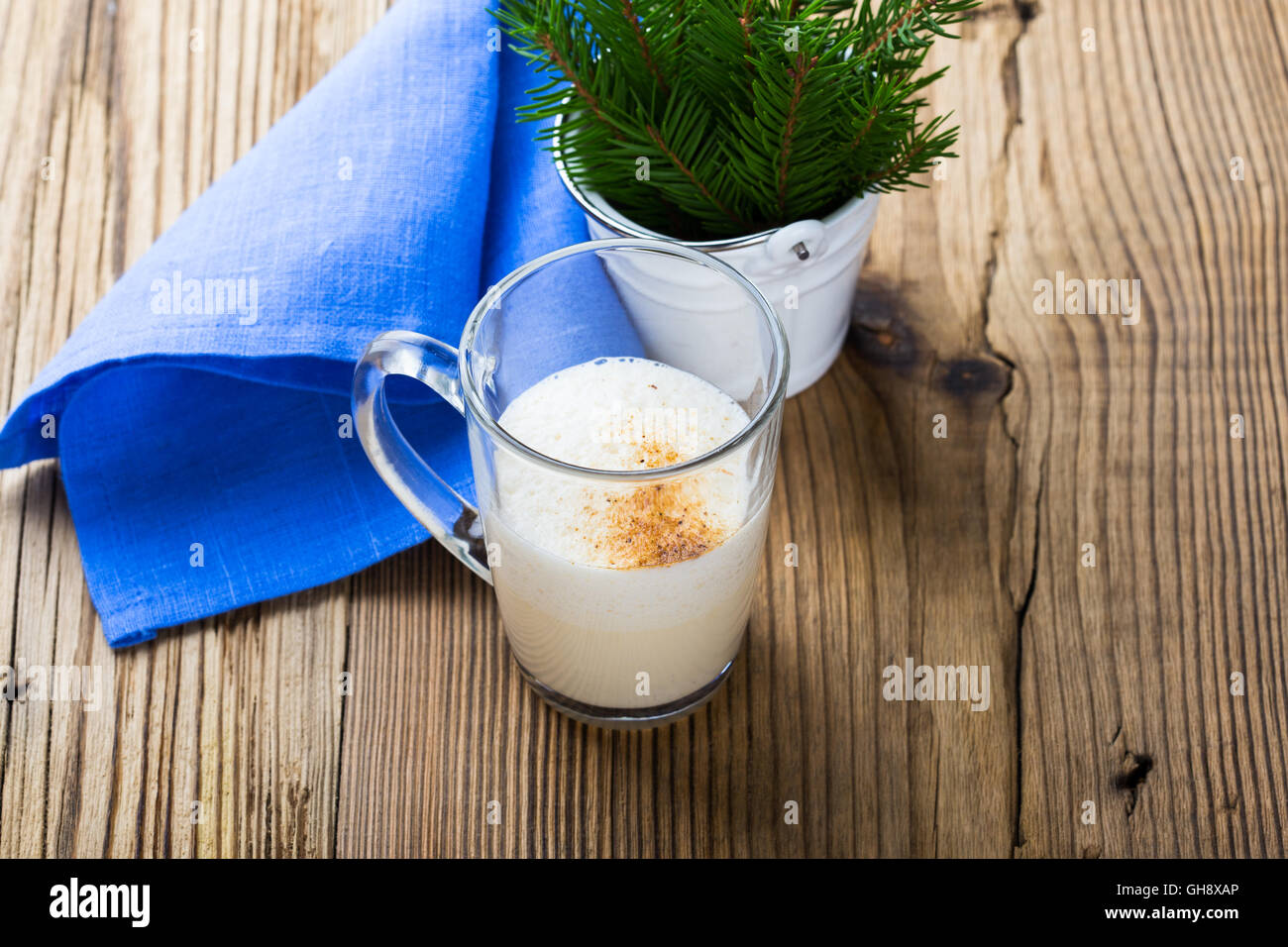 Traditional homemade egg milk punch on rustic wooden table Stock Photo ...