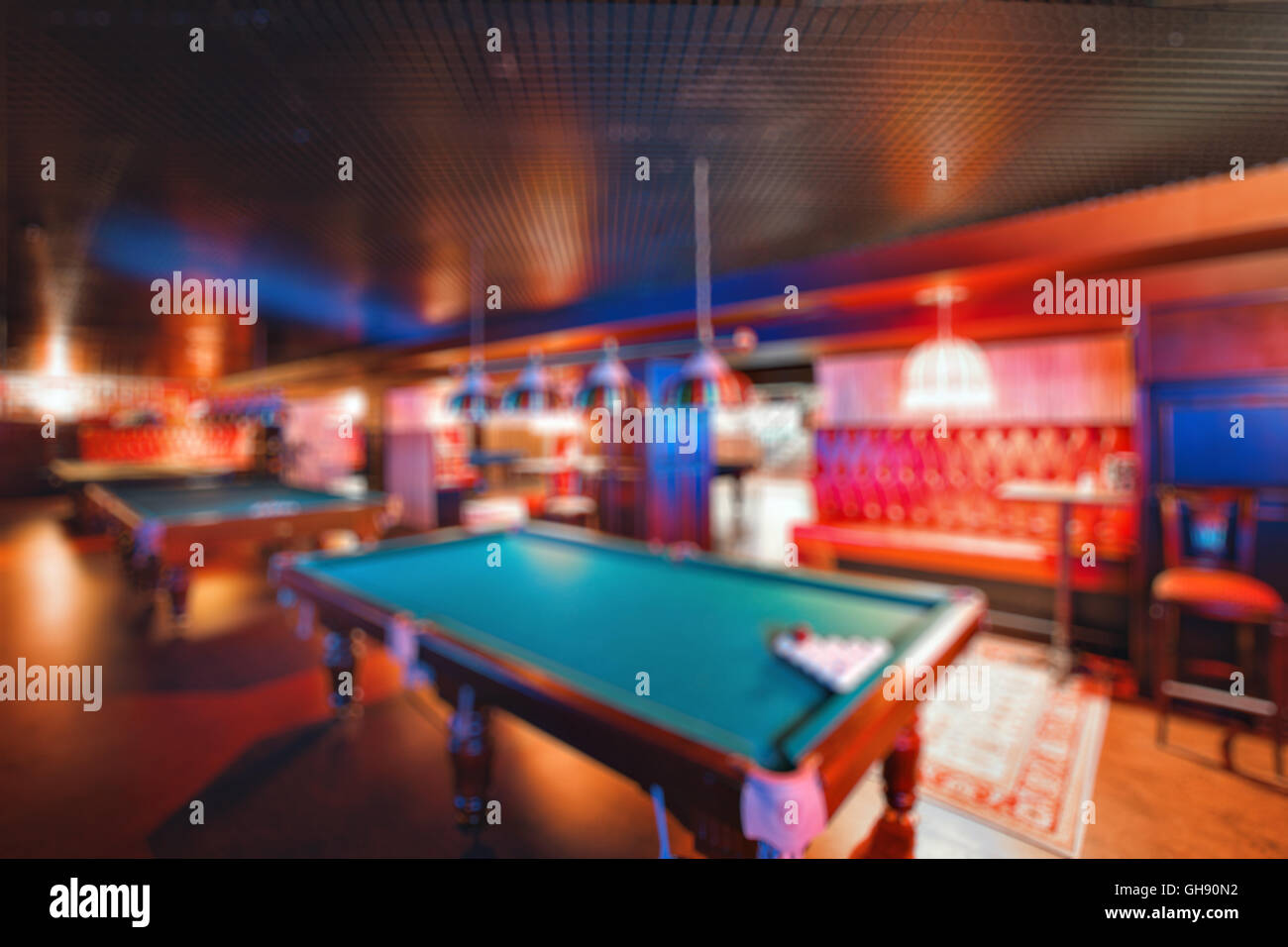 abstract blur. brand new and modern billiard interior in night time ...