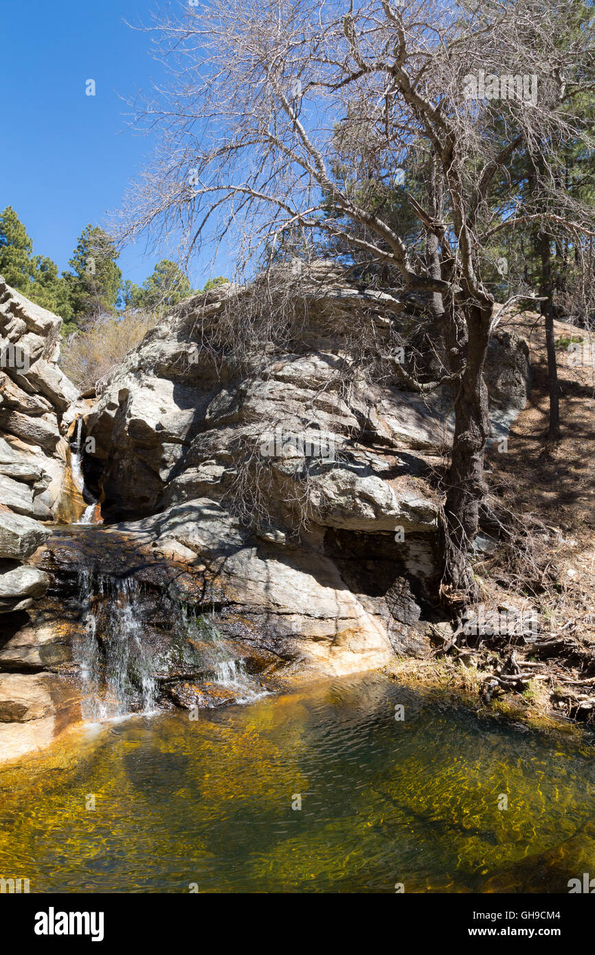 A waterfall pouring over a rocky ledge near Manning Camp on Mica ...