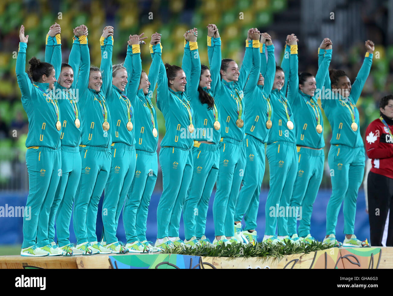 The Australian team celebrate with their gold medals after winning the ...