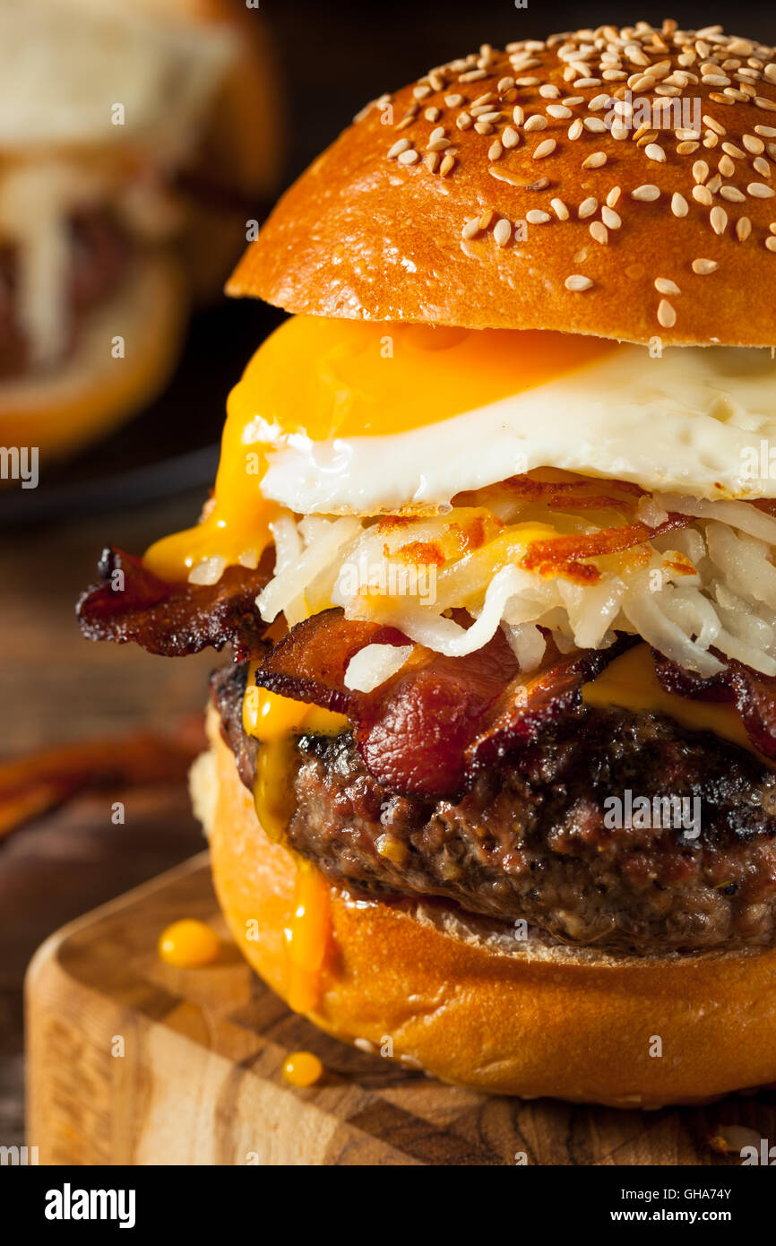 Homemade Breakfast Cheeseburger with Bacon Eggs and Hashbrowns Stock ...