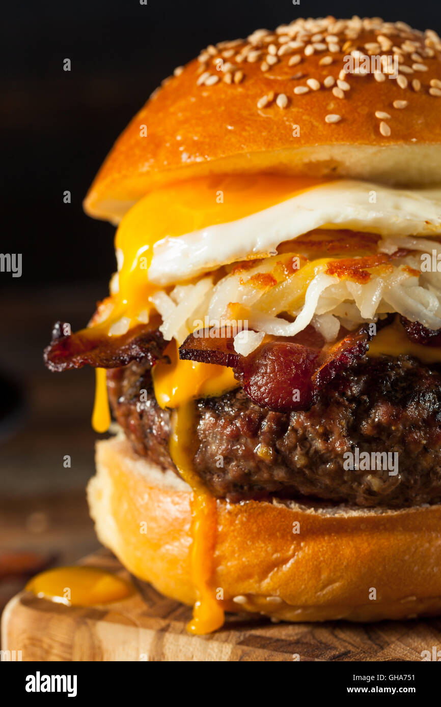 Homemade Breakfast Cheeseburger with Bacon Eggs and Hashbrowns Stock ...