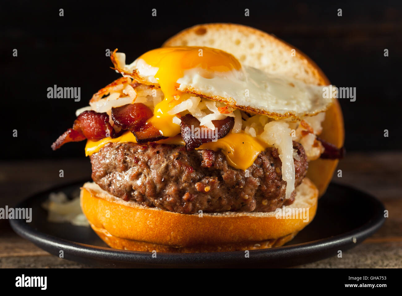 Homemade Breakfast Cheeseburger with Bacon Eggs and Hashbrowns Stock ...