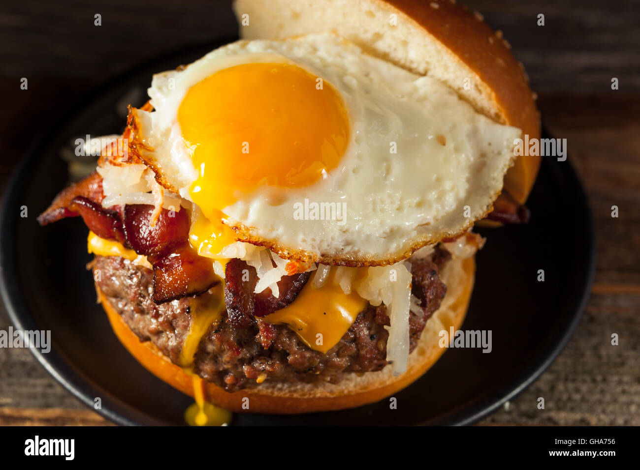 Homemade Breakfast Cheeseburger with Bacon Eggs and Hashbrowns Stock ...