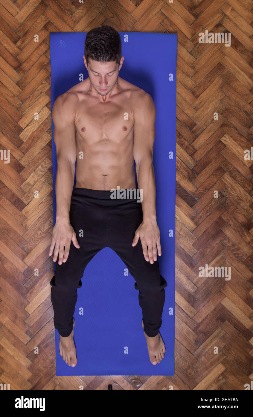 Young man elevated view abs forward workout down laying mat Stock Photo ...