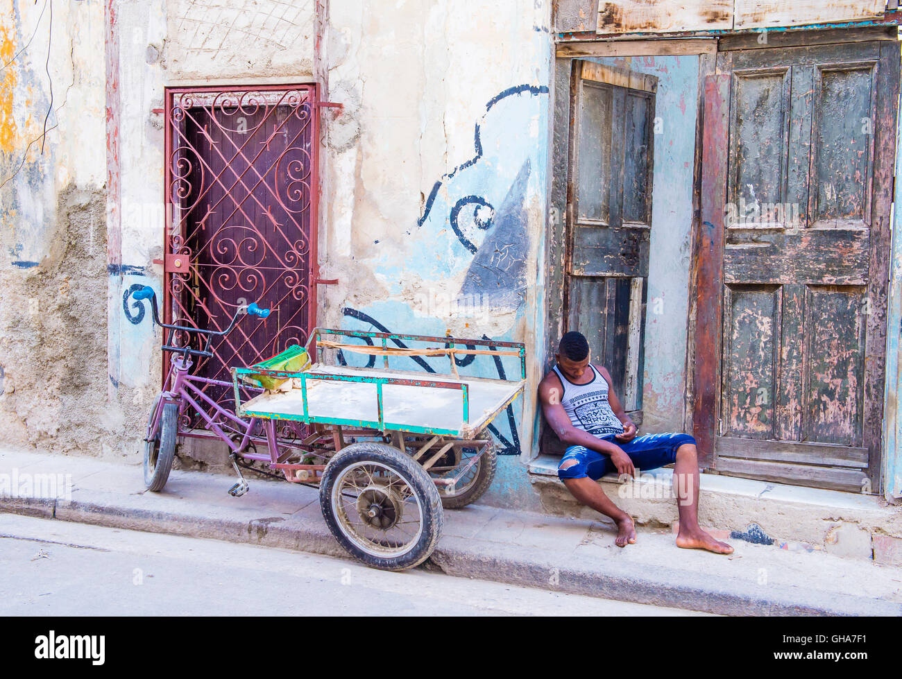 A Cuban rickshaw driver in old Havana street Stock Photo - Alamy
