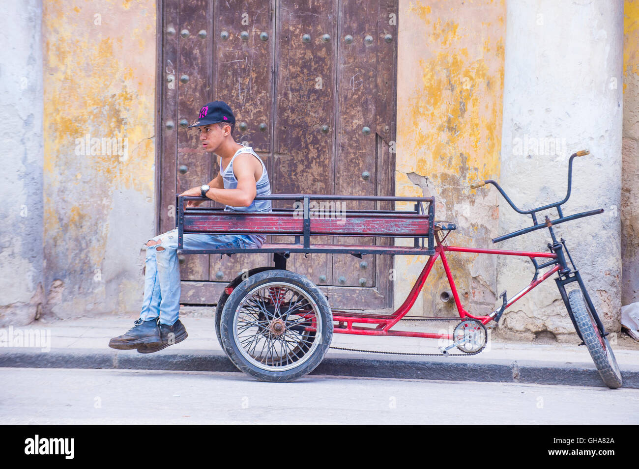 A Cuban rickshaw driver in old Havana street Stock Photo - Alamy