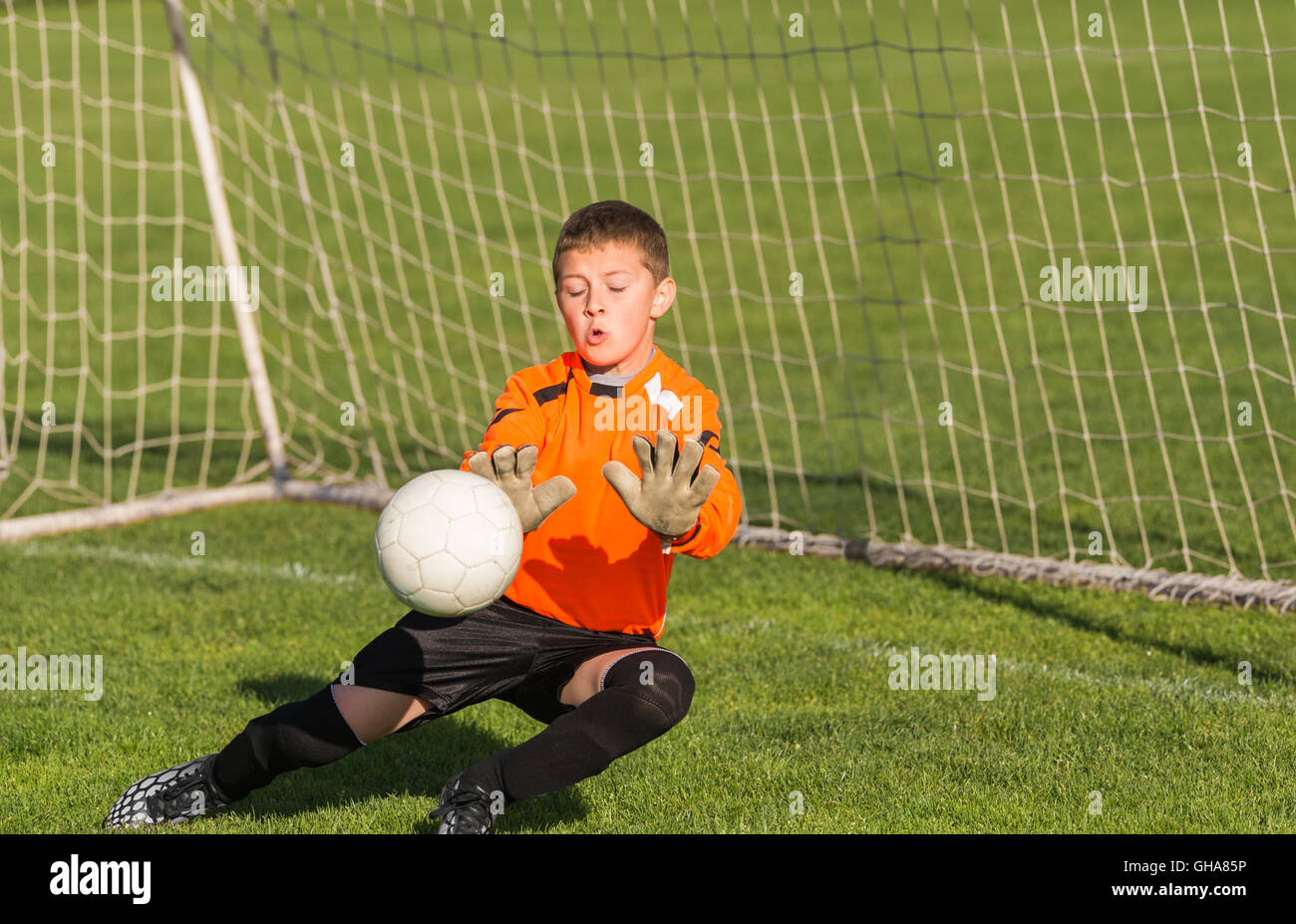 boy goalkeeper defends the goal Stock Photo - Alamy