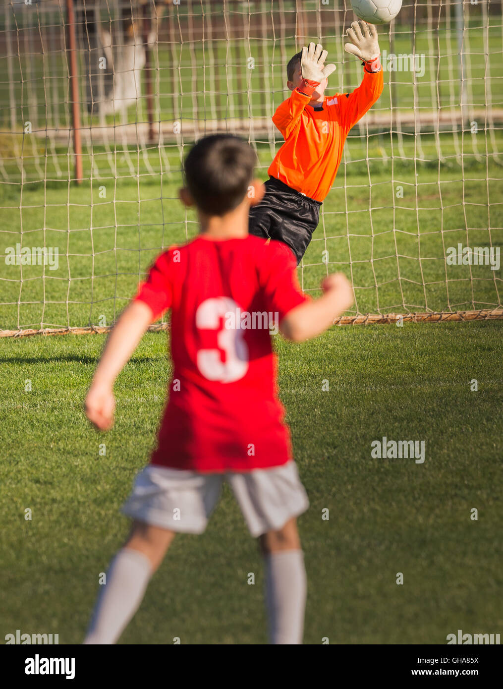 boy goalkeeper defends the goal Stock Photo - Alamy
