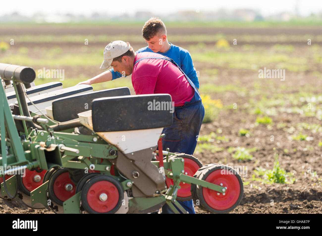father and son working in agriculture Stock Photo - Alamy