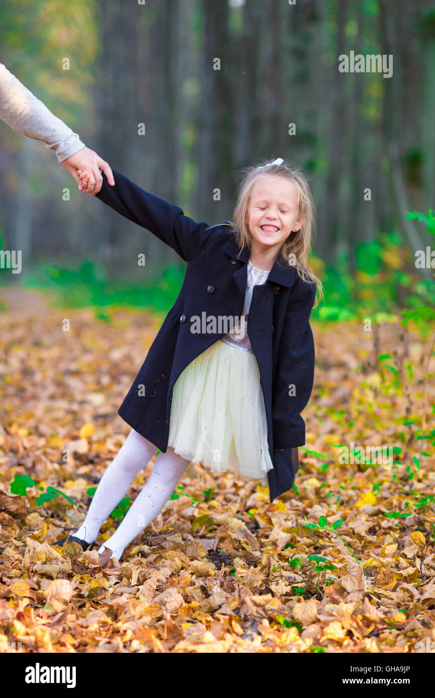 Adorable little girl outdoors at beautiful autumn day Stock Photo - Alamy