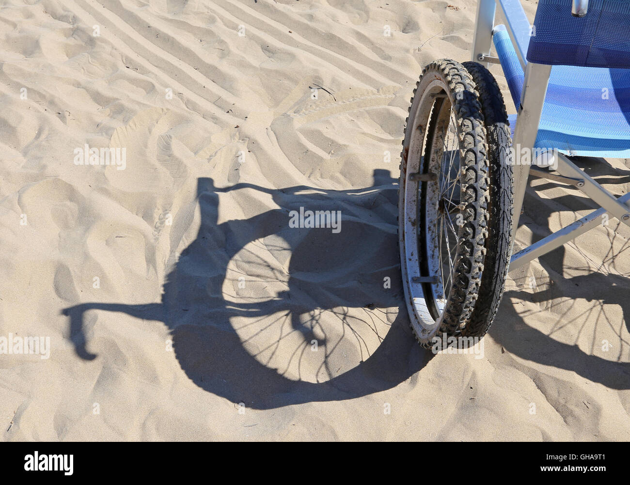 shadow of a wheelchair on the sand Stock Photo - Alamy