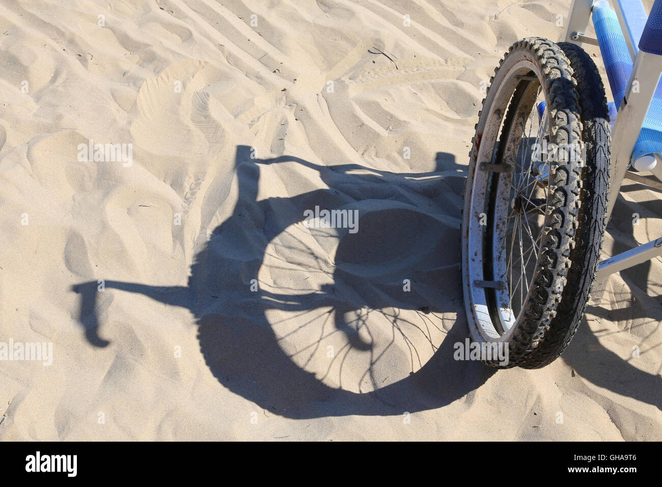shadow of a wheelchair on the beach sand Stock Photo - Alamy