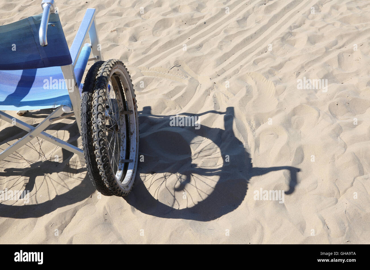 shadow of a wheelchair on the beach sand Stock Photo - Alamy