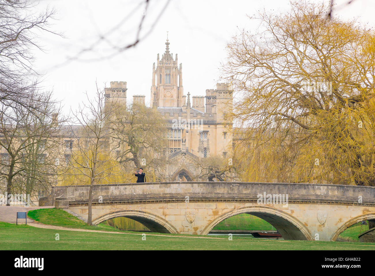 A Japanese tourist photographs himself on Trinity Bridge against the ...