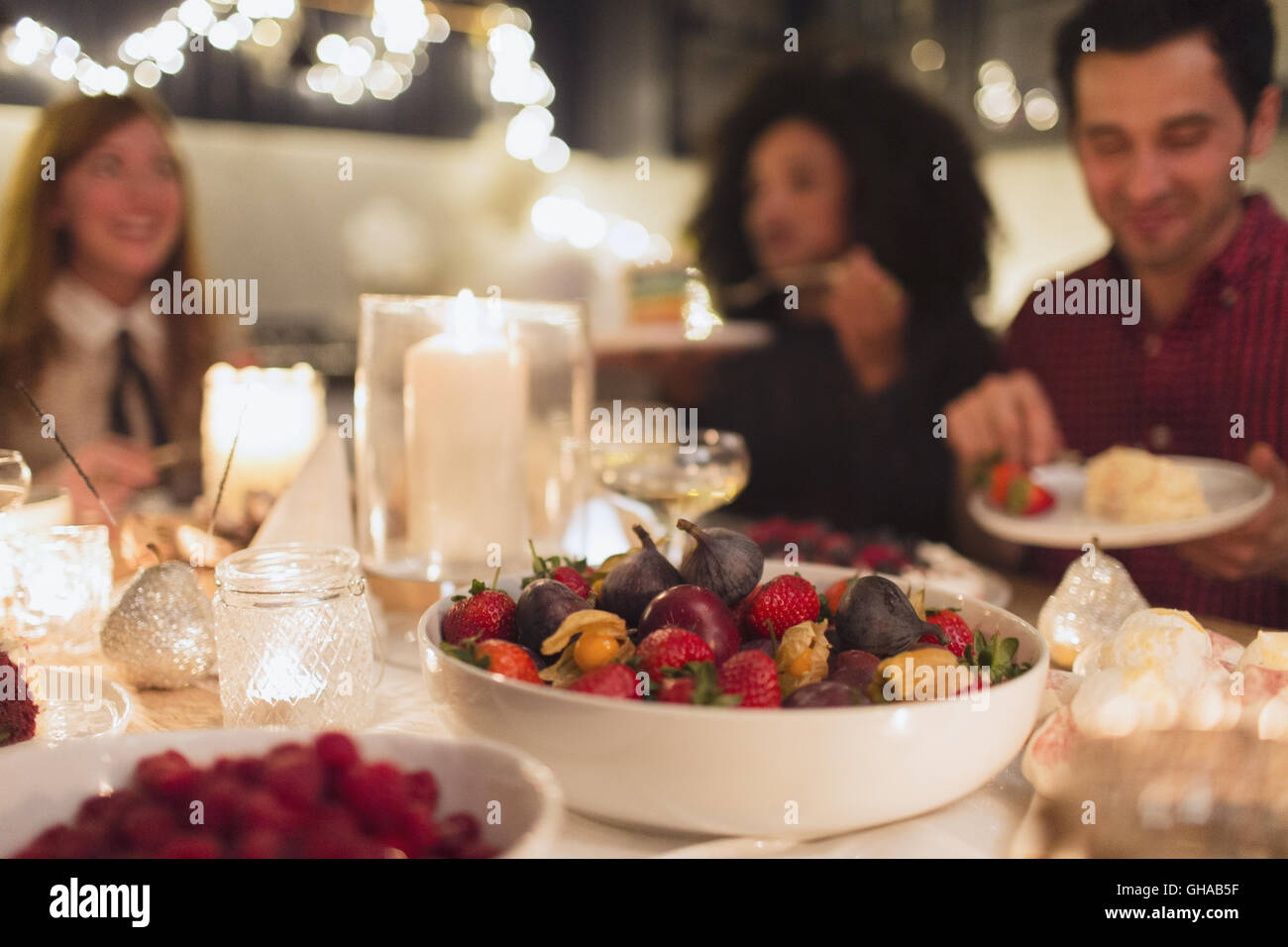 Candlelight Christmas dinner party Stock Photo - Alamy