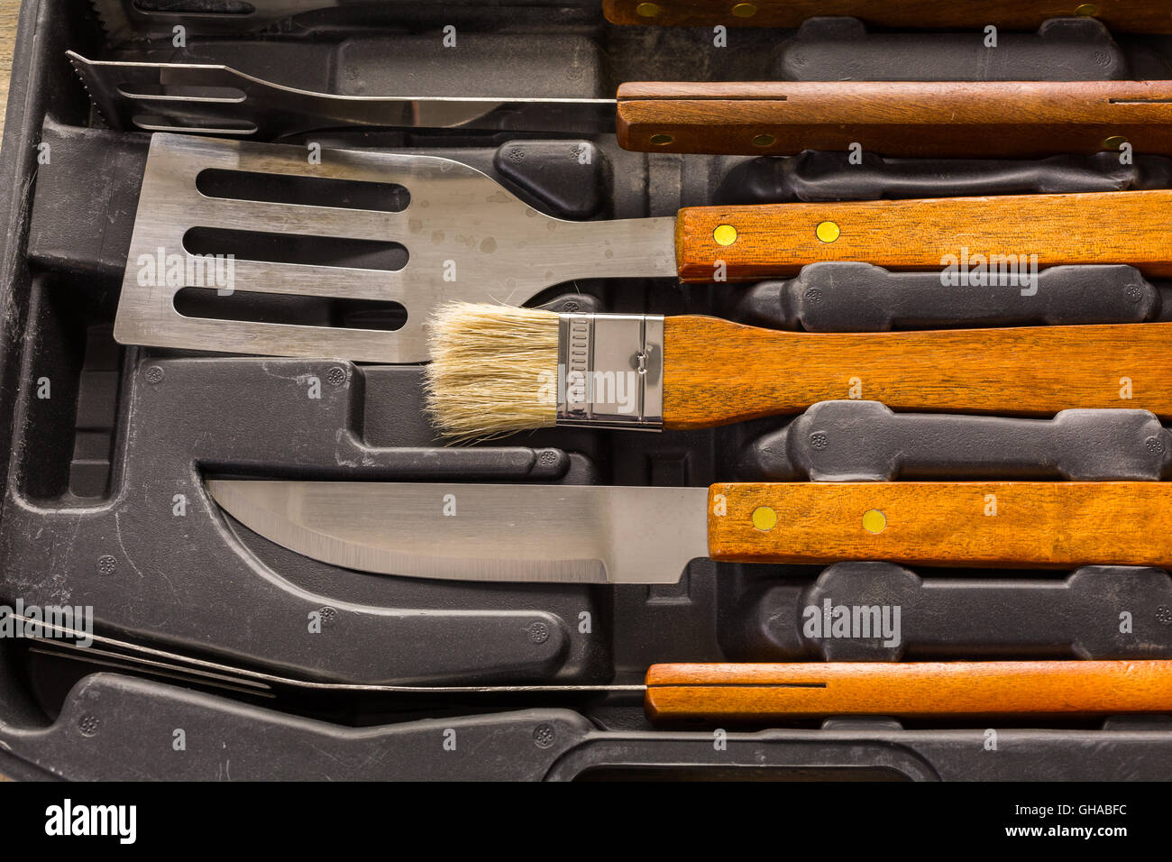 Stainless steel barbecue cooking set with wood handles Stock Photo - Alamy