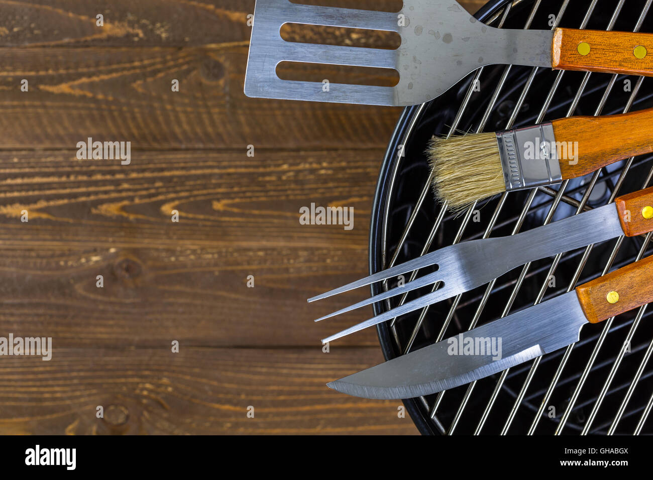 Stainless steel barbecue cooking set with wood handles Stock Photo - Alamy