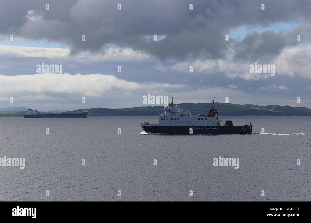 Calmac ferry MV Argyle passing oil tanker in Firth of Clyde Scotland ...