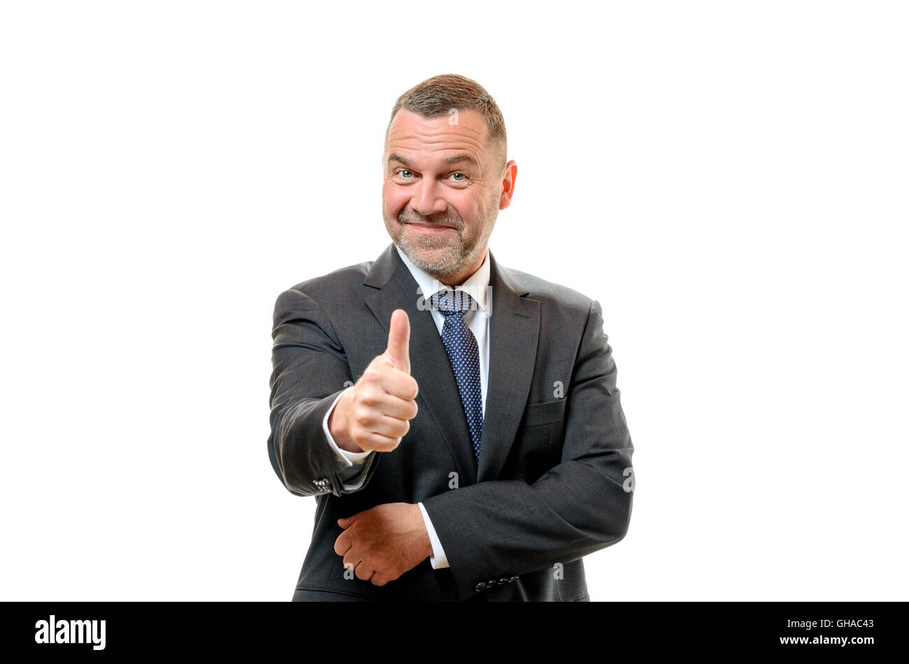 Enthusiastic smart middle-aged businessman giving a thumbs up with a ...