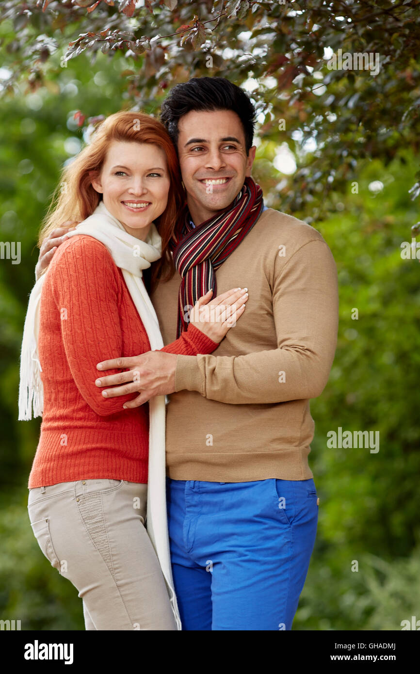 Happy couple walking together Stock Photo - Alamy