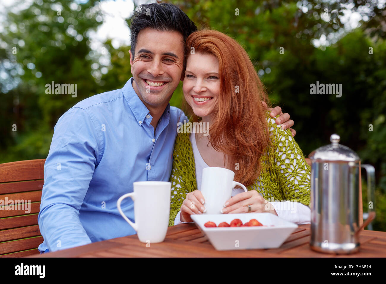 Couple relaxing outdoors Stock Photo - Alamy