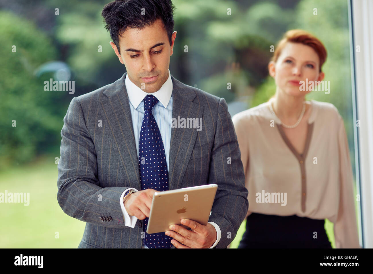 Two business people discussing work Stock Photo - Alamy Two business people discussing work Stock Photo - Alamy